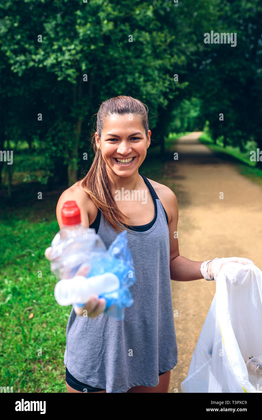 Girl showing garbage she has collected Stock Photo - Alamy