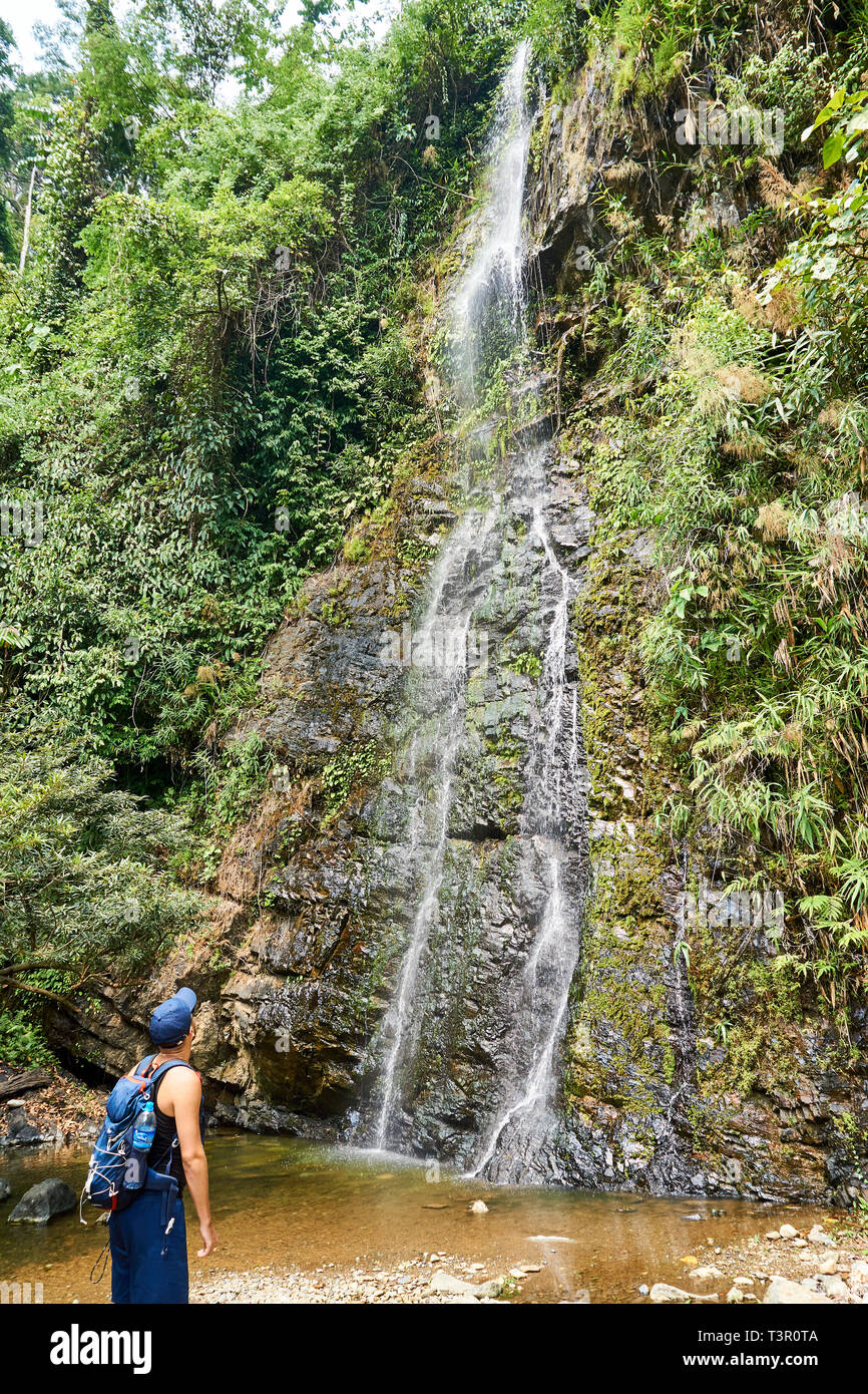 Man watching waterfall at holiday in Vang Vieng , Loas Stock Photo - Alamy