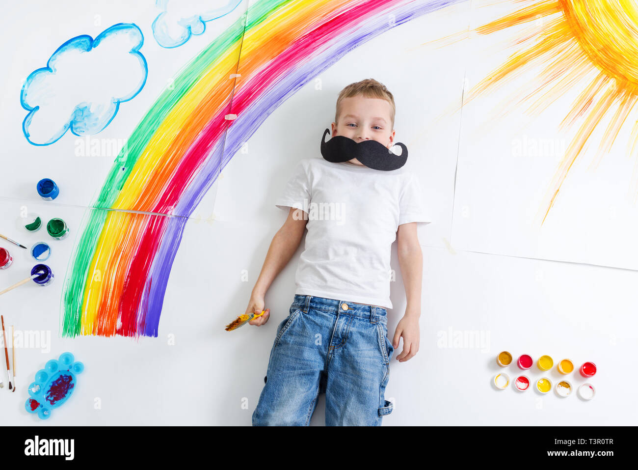 kid painting rainbow Stock Photo - Alamy