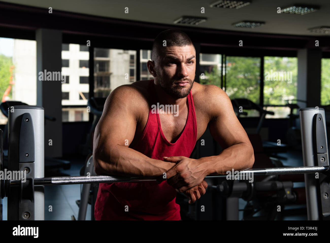 Fitness Athlete Relaxing In Gym After Exercise Stock Photo - Alamy