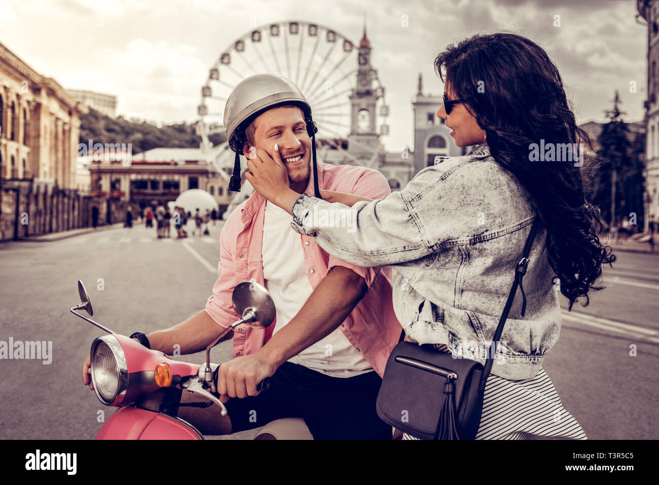 Joyful positive couple smiling to each other Stock Photo - Alamy