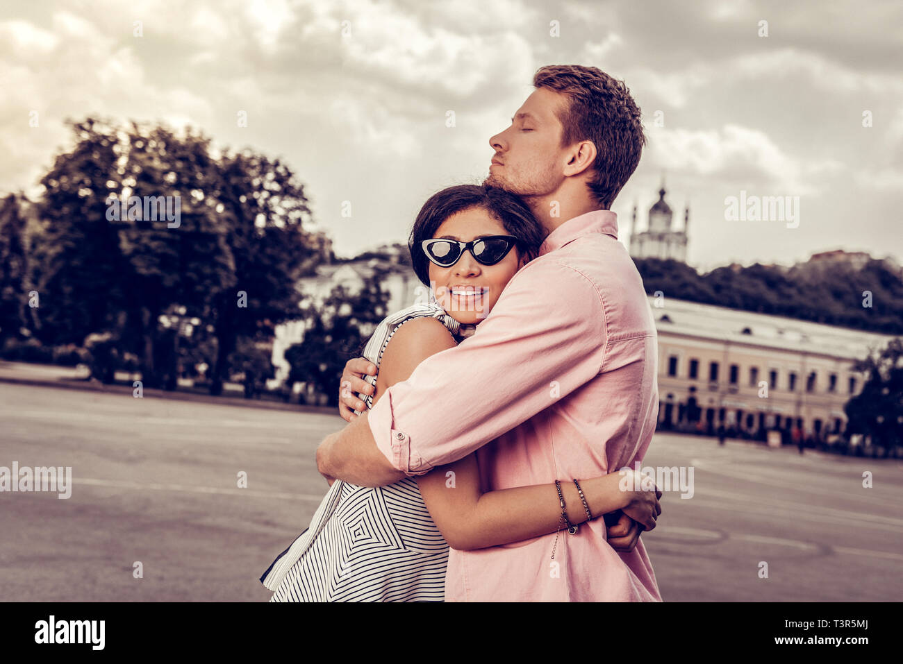 Two lovers hugging each other hi-res stock photography and images - Alamy