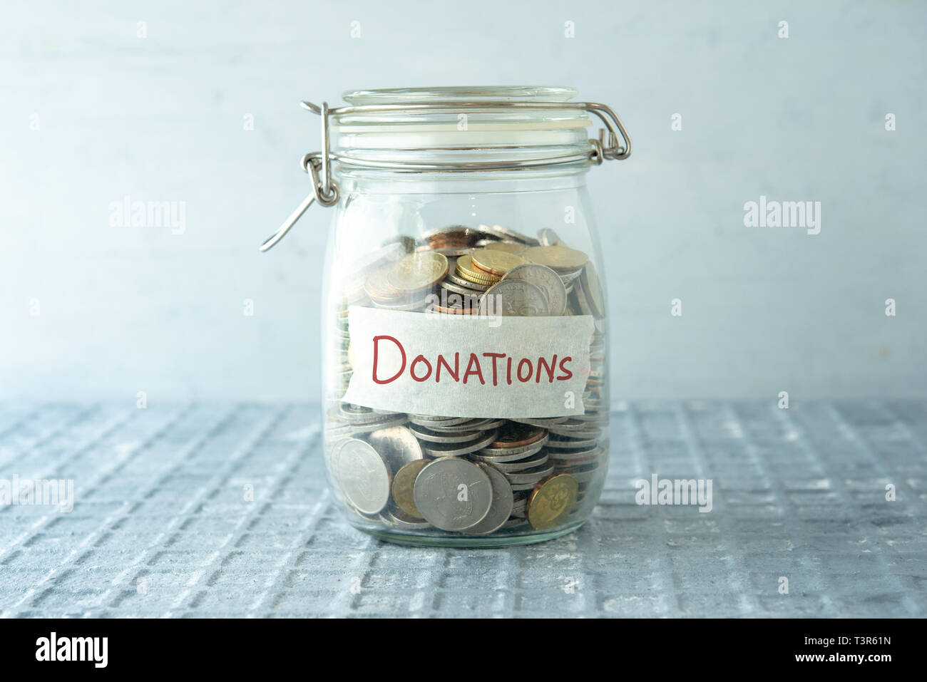 Money jar hi-res stock photography and images - Alamy