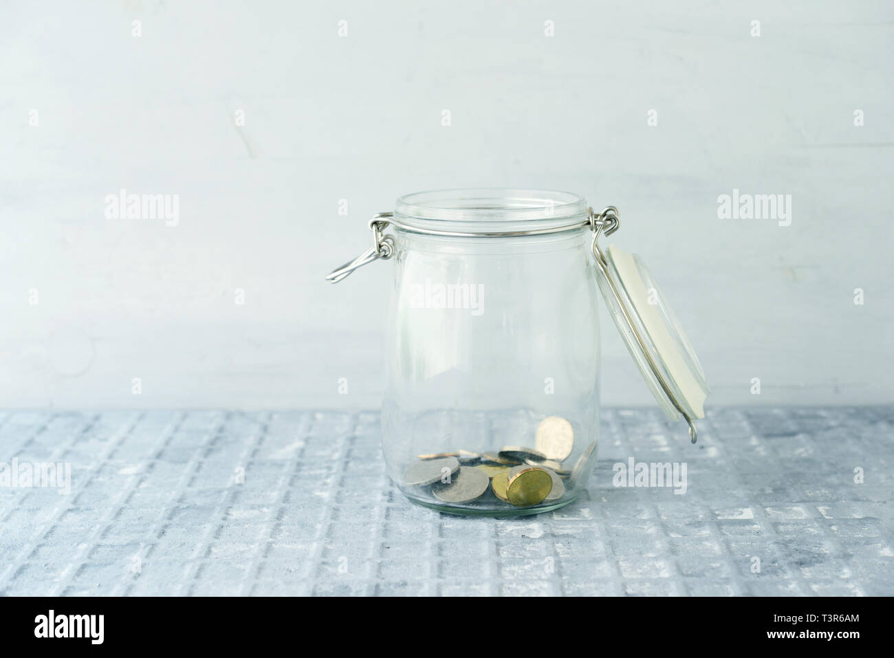 Coins in glass money jar, financial concept Stock Photo - Alamy