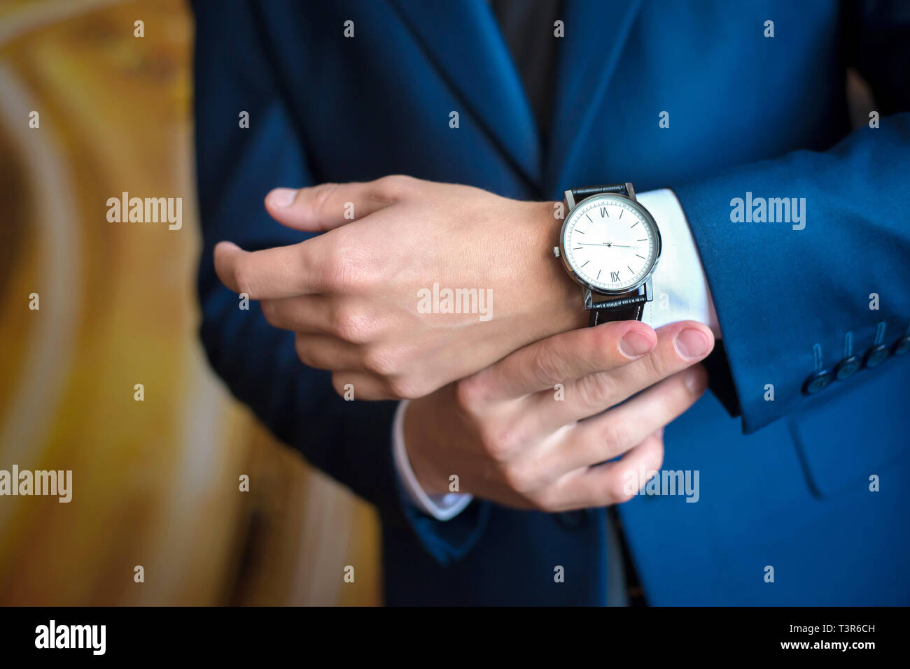Man in suit with watch fashion hi-res stock photography and images - Alamy