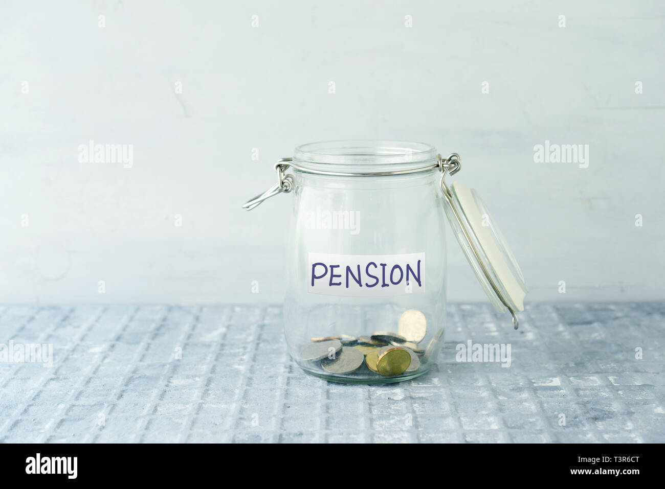 Coins in glass money jar with pension label, financial concept Stock ...