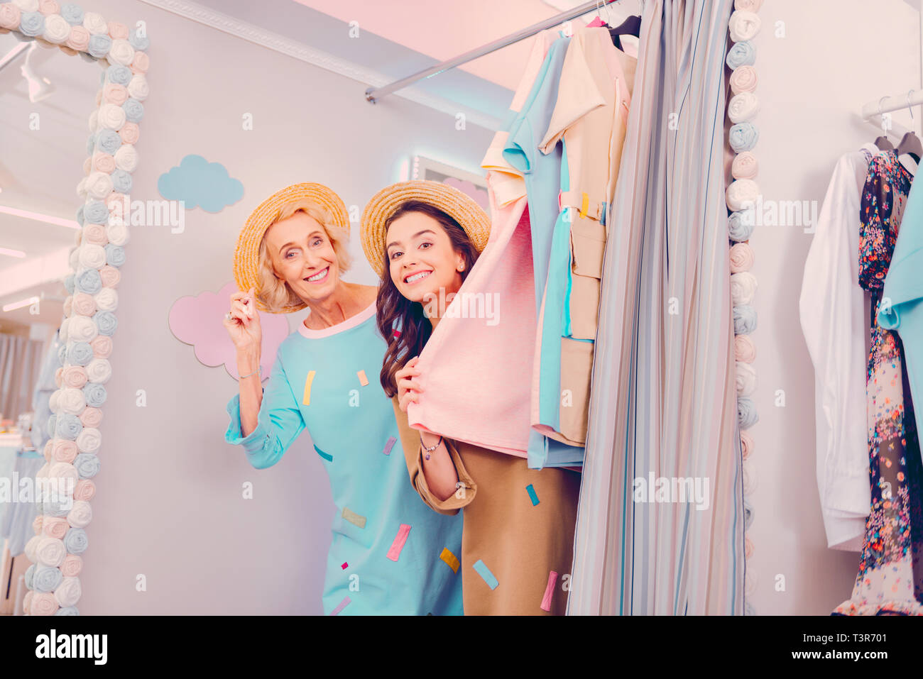 Mother and an adult daughter fitting clothes together Stock Photo - Alamy