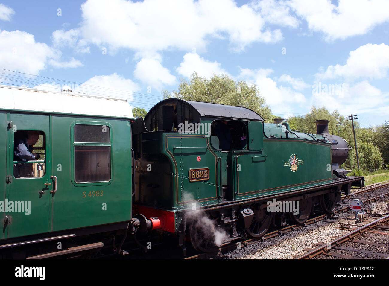Swanage Steam Train departing Corfe Castle Station in Dorset, UK Stock ...