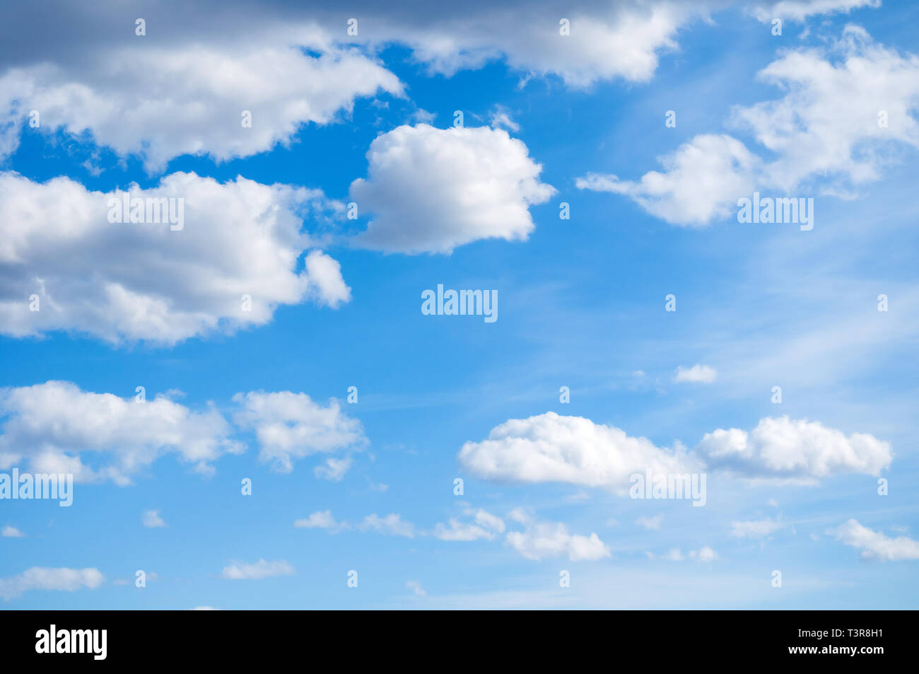 Blue sky background with white dramatic colorful clouds and sunlight ...