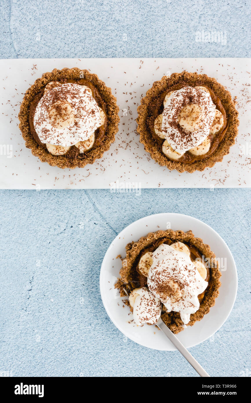 Homemade Banoffee Pie tartlets with salted caramel, banana slices ...
