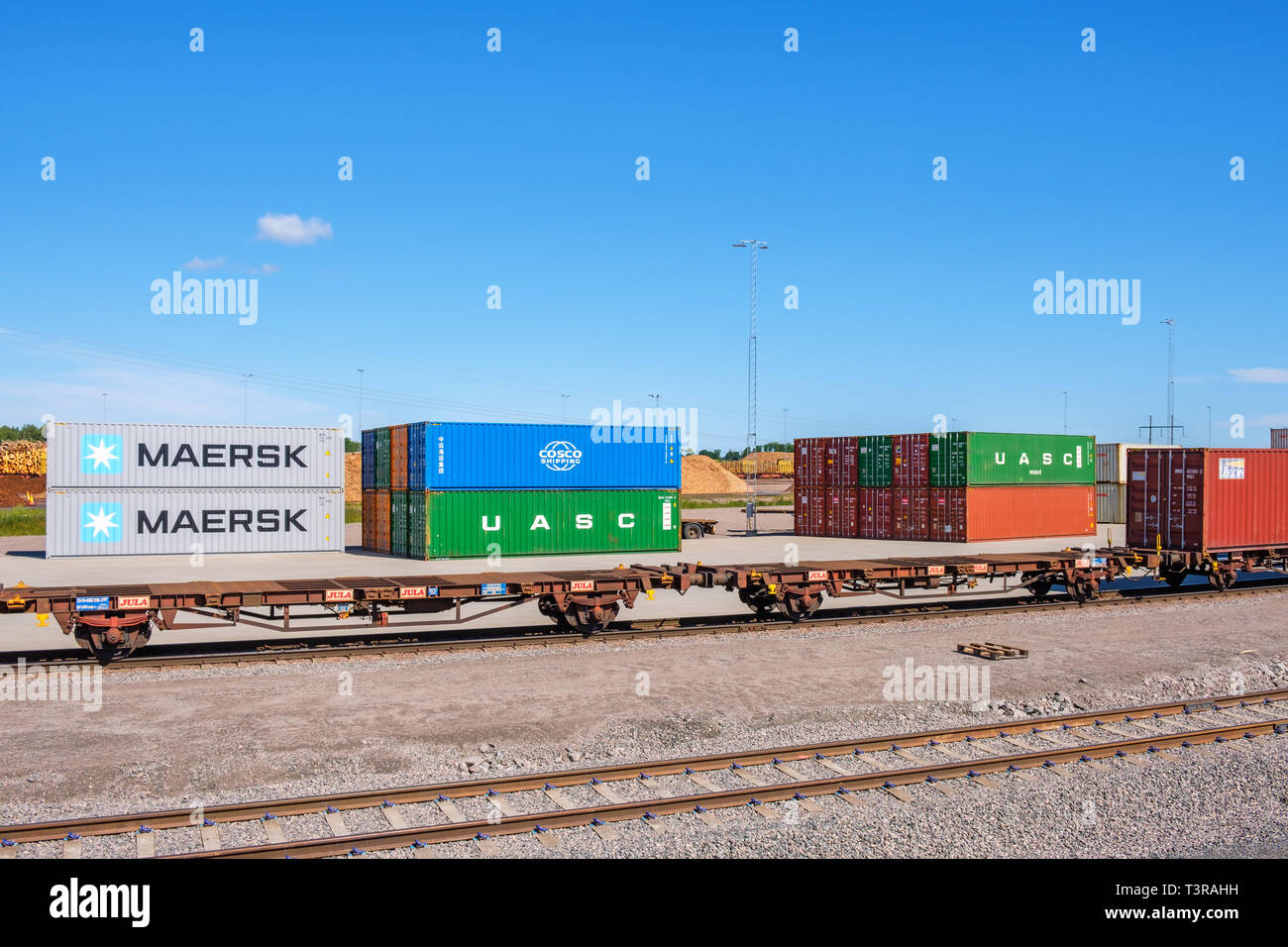 Containers and train wagons on a yard Stock Photo - Alamy