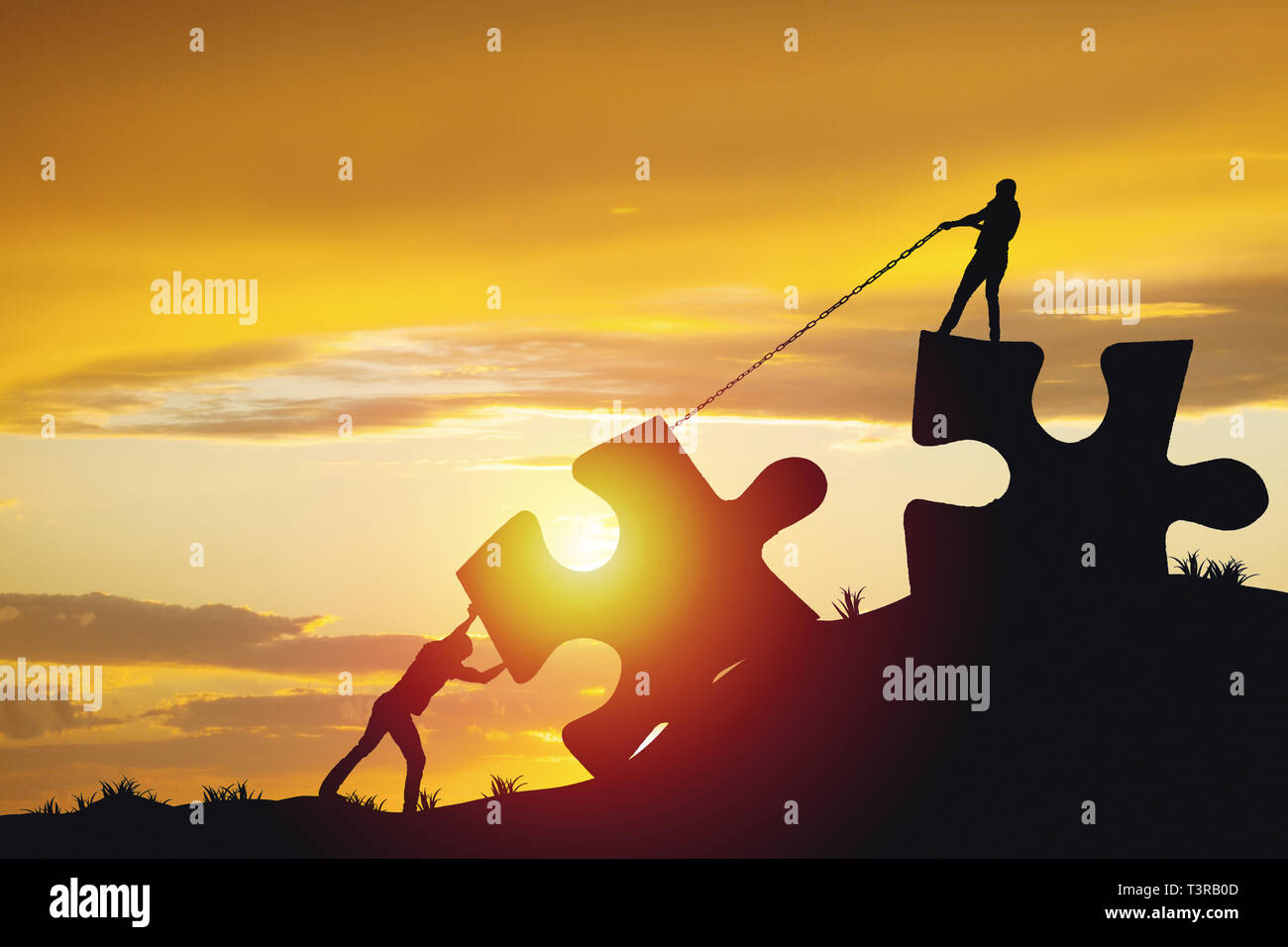 Two people join two huge puzzles. Working in collaboration for success ...