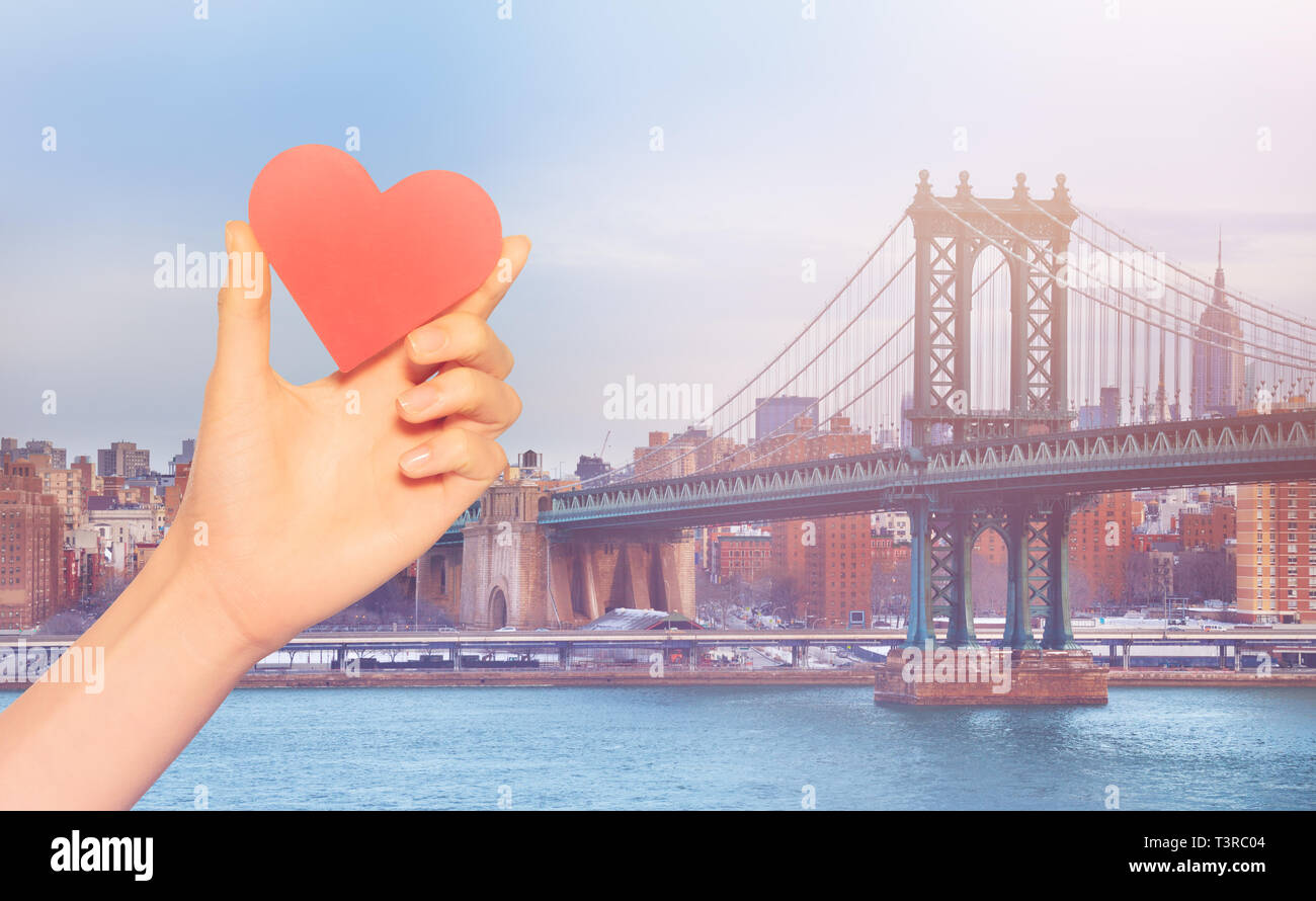 Hand hold red heart over Brooklyn Bridge New York Stock Photo - Alamy