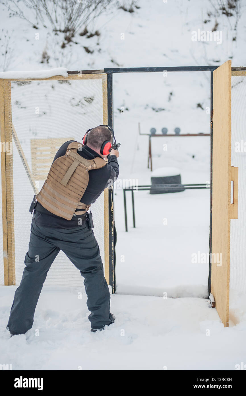 Indoor combat gun shooting training inside house. Advanced fighting ...