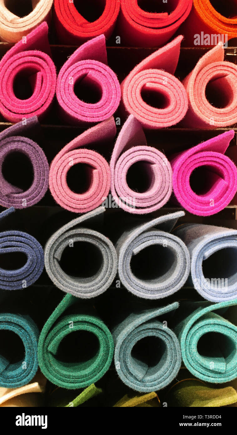 colored big rolls of fabric in the rack of the tailoring for sale Stock ...