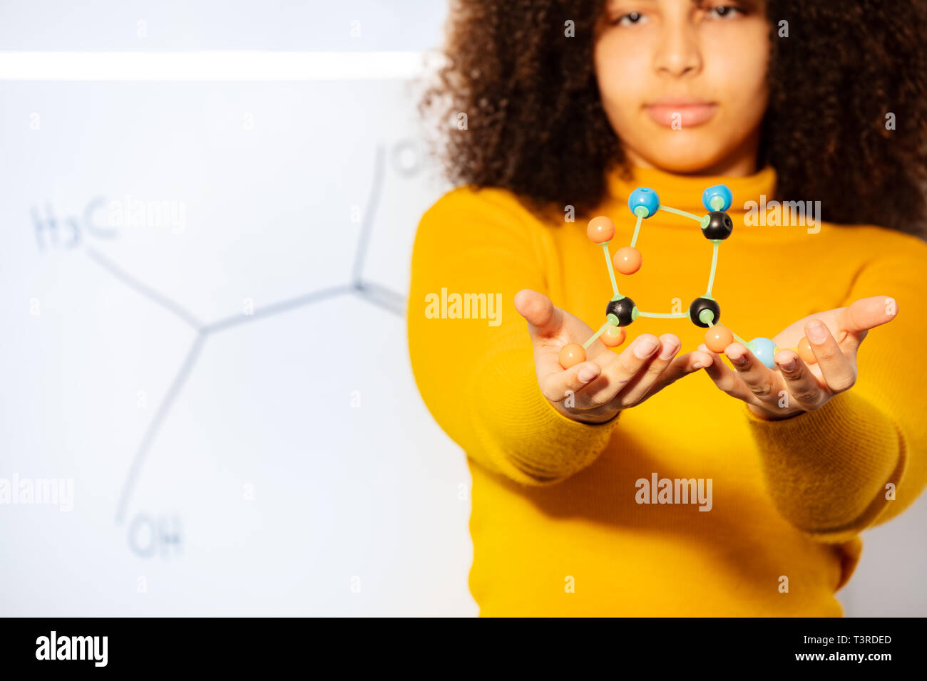 Closeup of acid molecule in student girls hands Stock Photo - Alamy