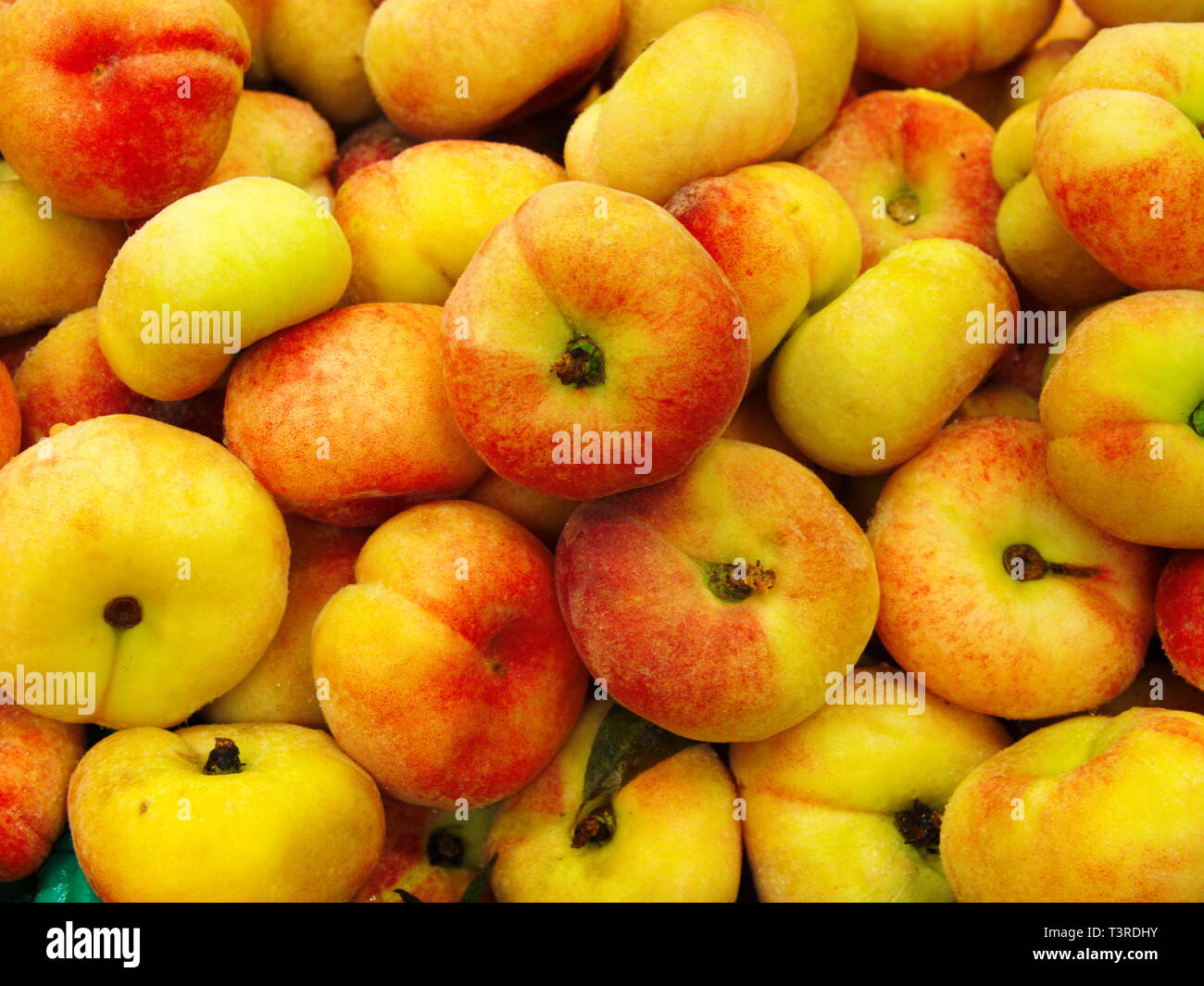 Saturn Peach. flat tomato peach. pale yellow colored, white meated and ...