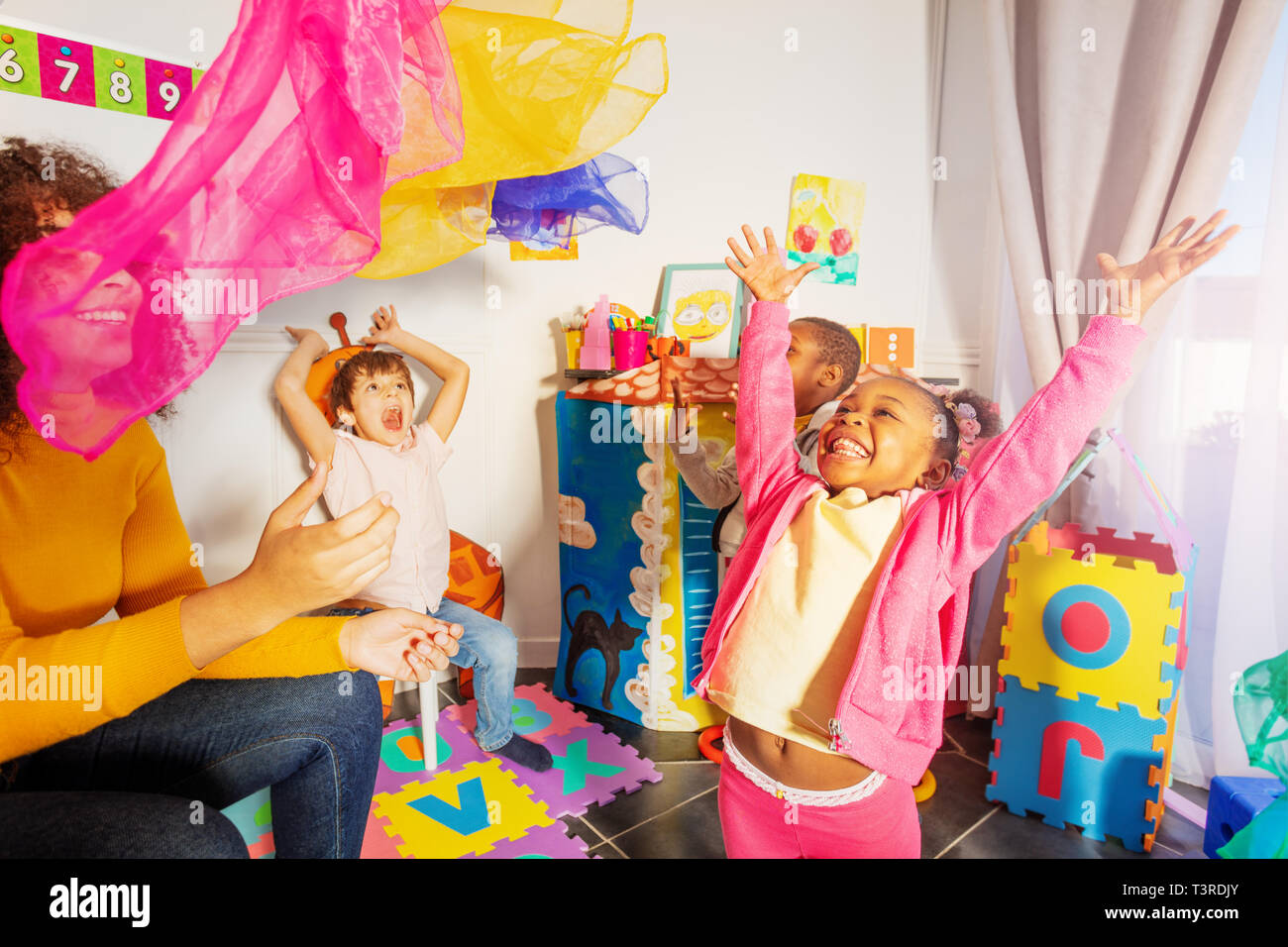 Group of happy laughing kids throw handkerchief Stock Photo - Alamy