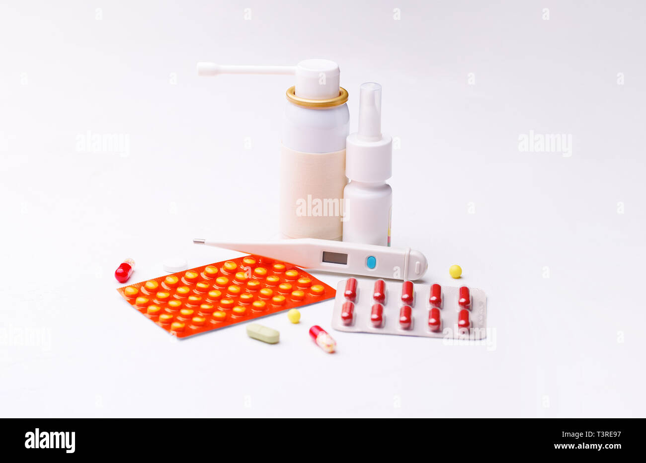 Treatment of flu. Throat spray, nose drops, cold pills and thermometer ...