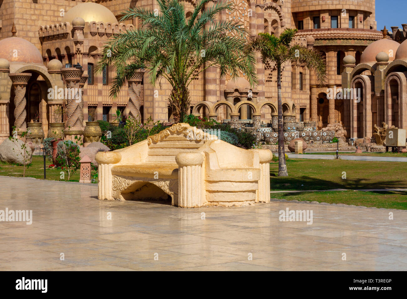 Antique stone bench of solid stone blocks against the background of ...