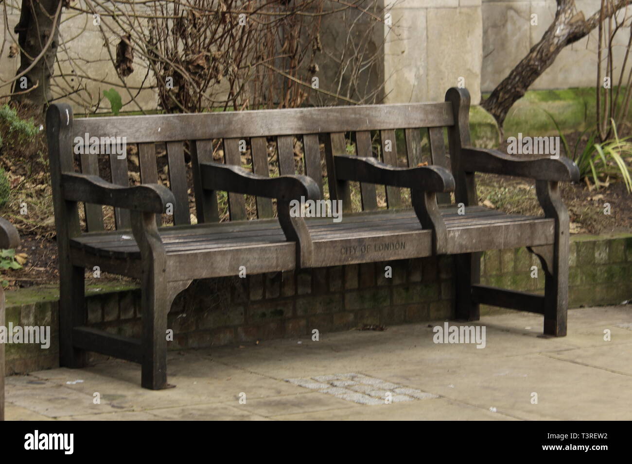 Wooden bench in a hidden part of London Stock Photo - Alamy