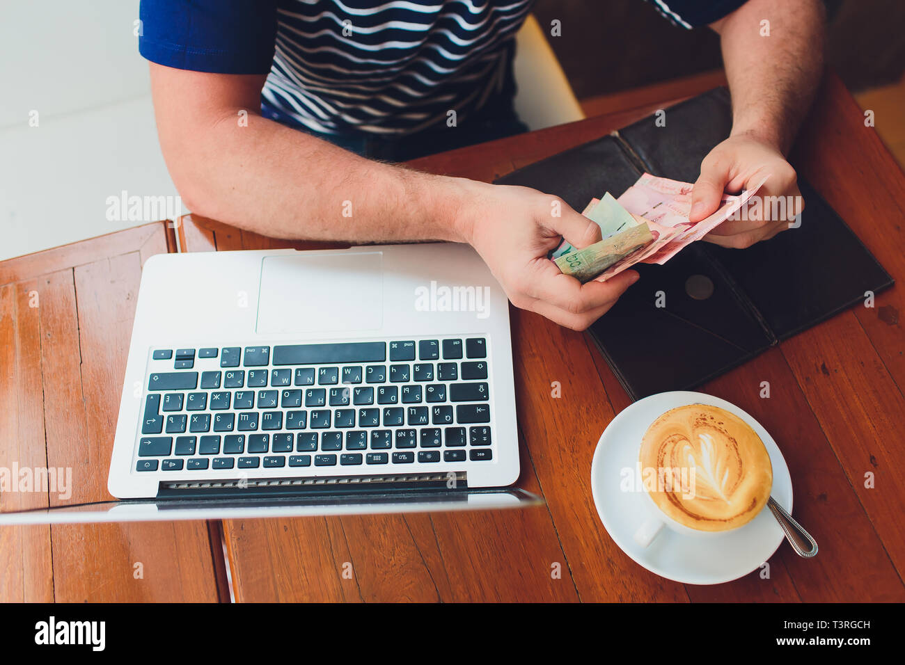 man paying bill in cafe. He putting money. Busy man having lunch in ...