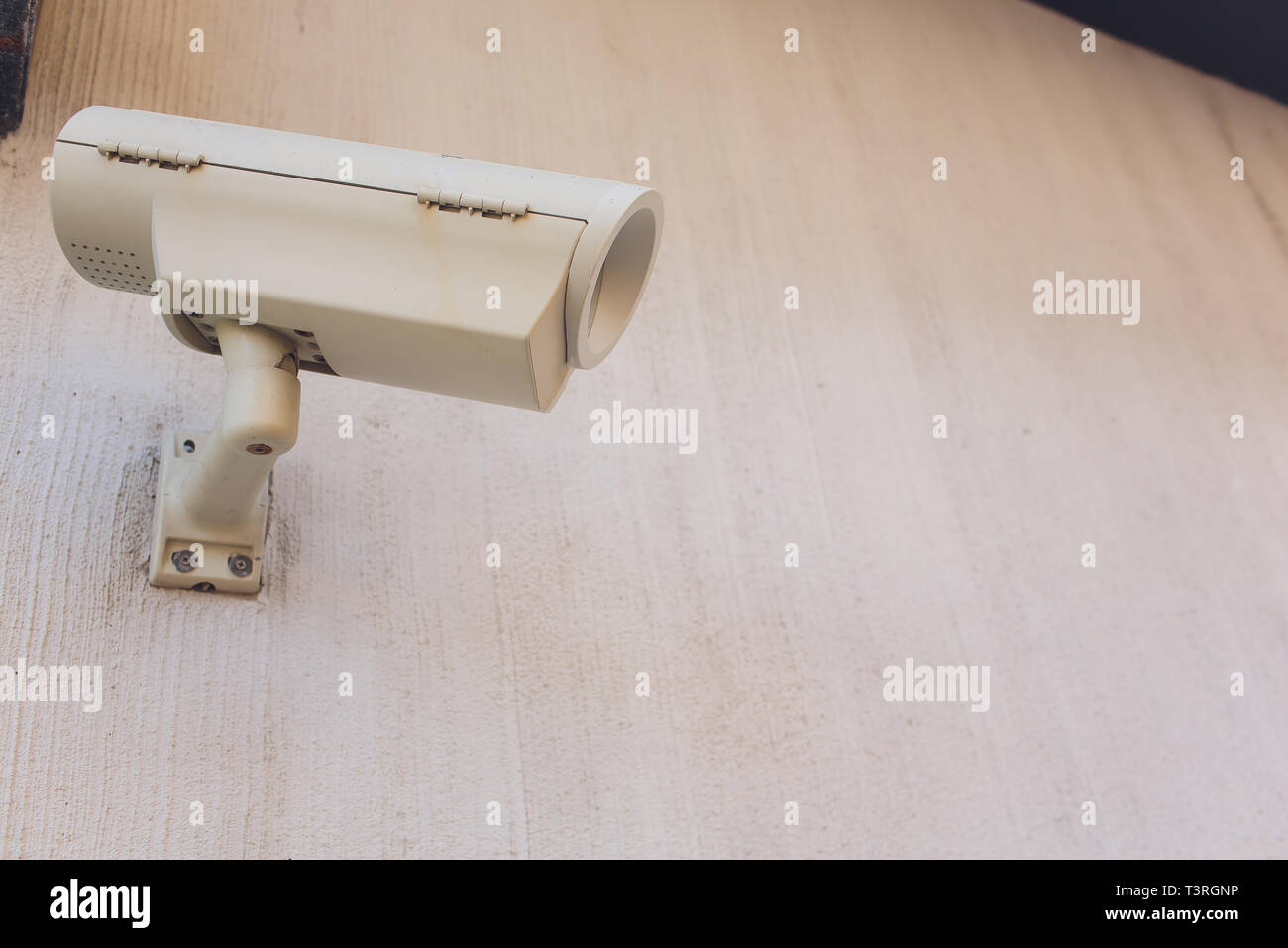 CCTV camera or surveillance installed on wall Stock Photo - Alamy
