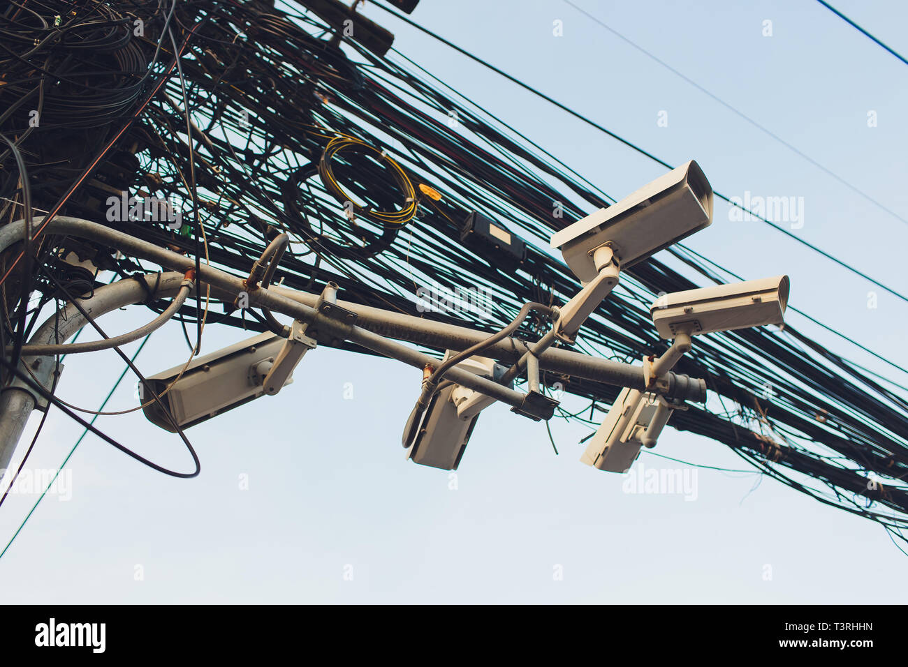 Crazy messy chaos wires cables on Electric poles Stock Photo - Alamy