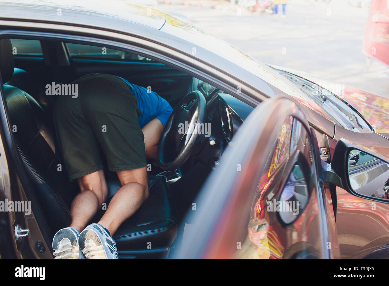 A man that is locked out of his car Stock Photo - Alamy