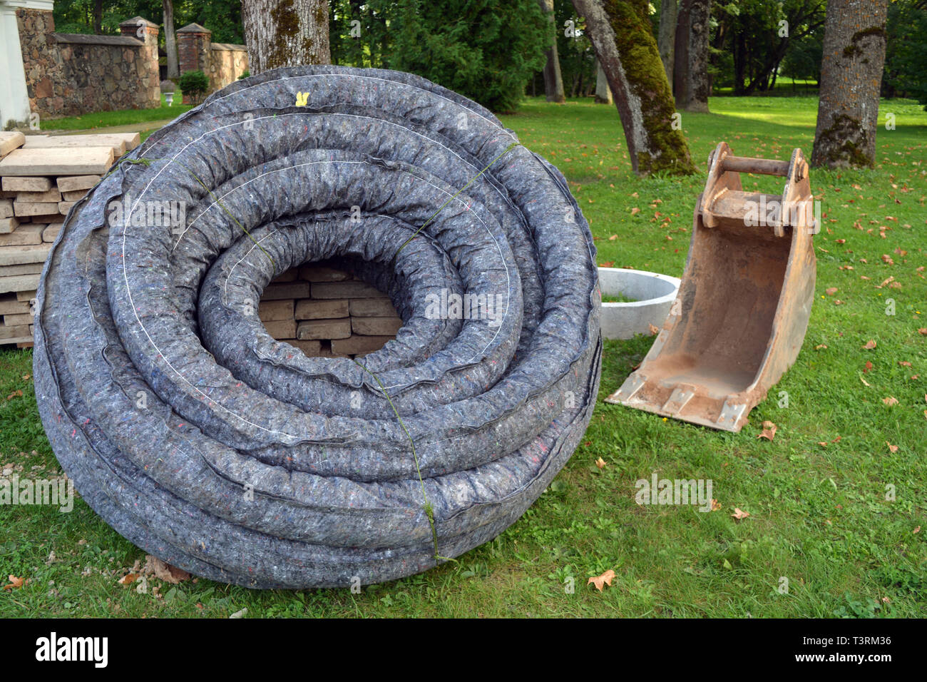 Roll stack drain drainage pipe with protective cover in park and ...