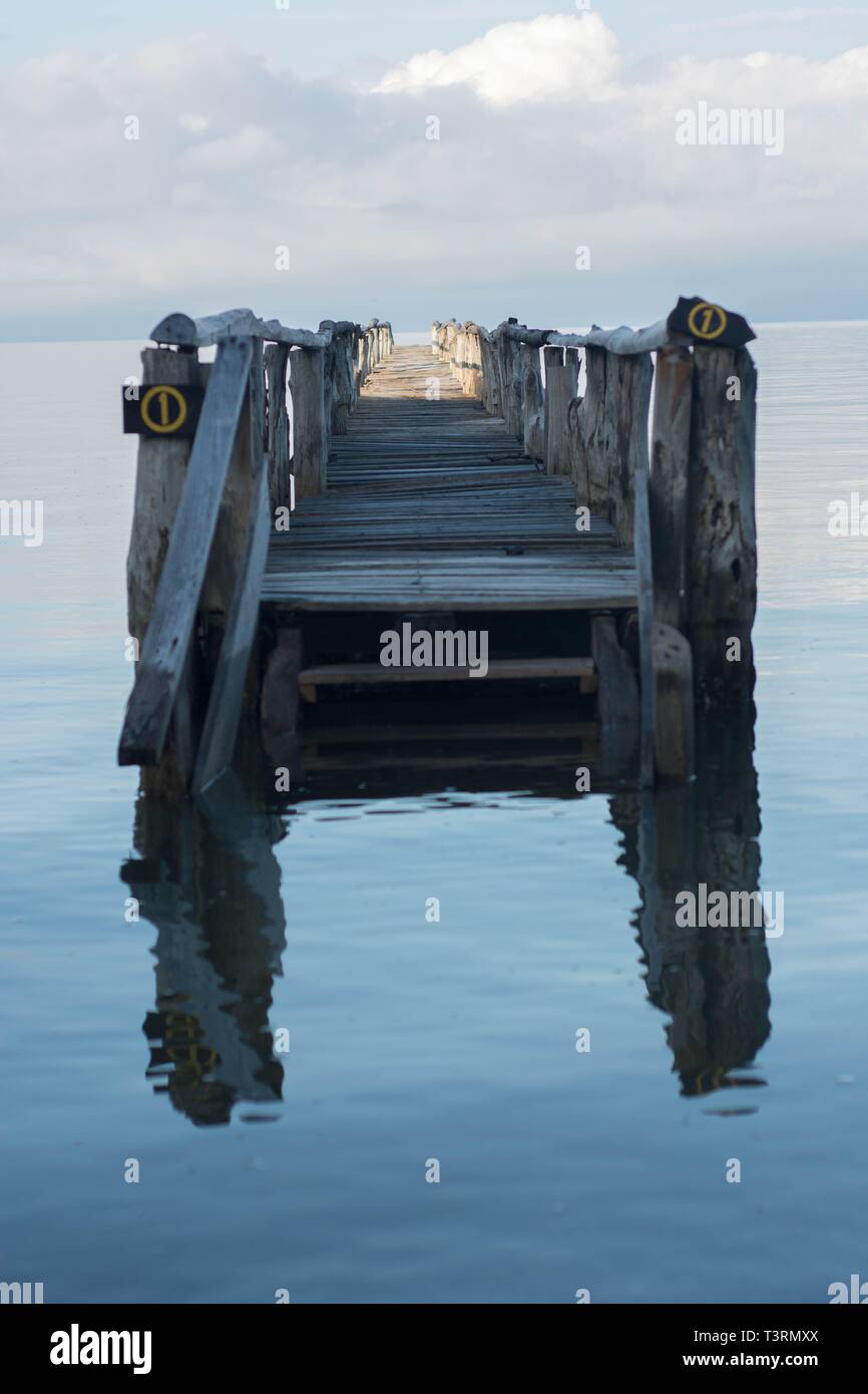 A wooden bridge in the middle of the water Stock Photo - Alamy