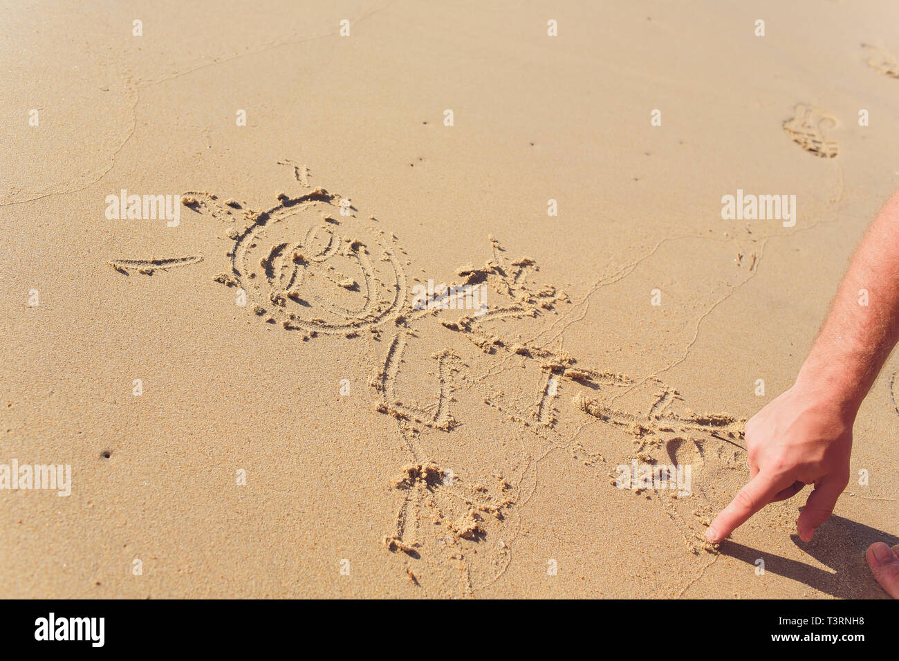 a depressed man drawing by his finger a sad smiley Stock Photo - Alamy