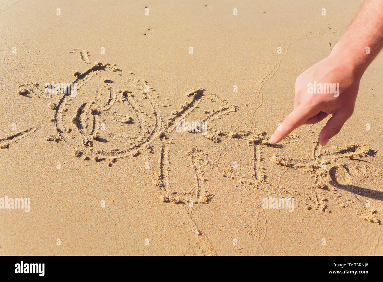 a depressed man drawing by his finger a sad smiley Stock Photo - Alamy