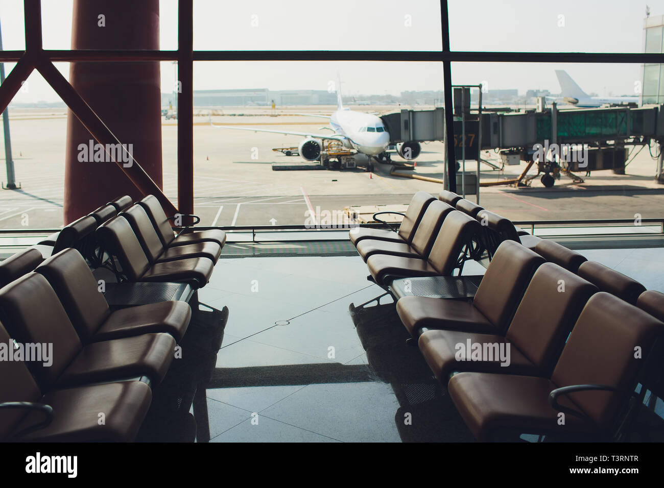 Interior inside airport terminal. Lounge with chairs in waiting ...