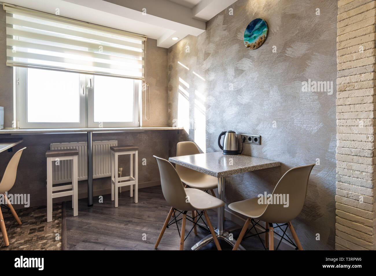 Fragment of the kitchen interior, with a dining table Stock Photo - Alamy