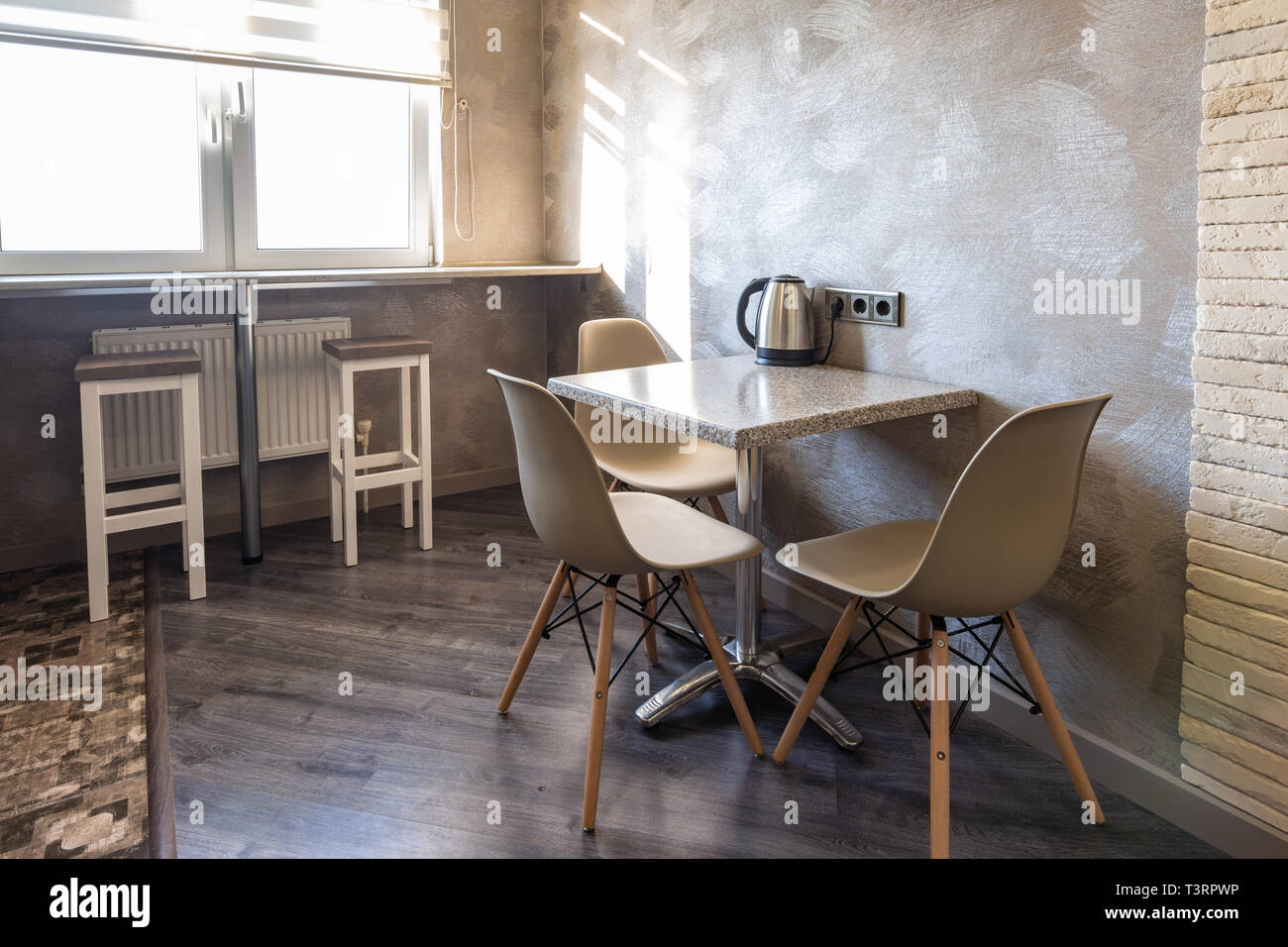 A table with chairs in the interior of the kitchen Stock Photo - Alamy