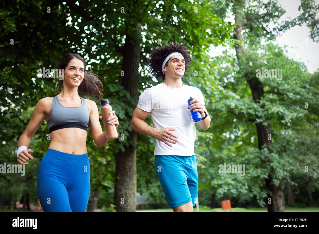 Young happy man jogging in hi-res stock photography and images - Alamy