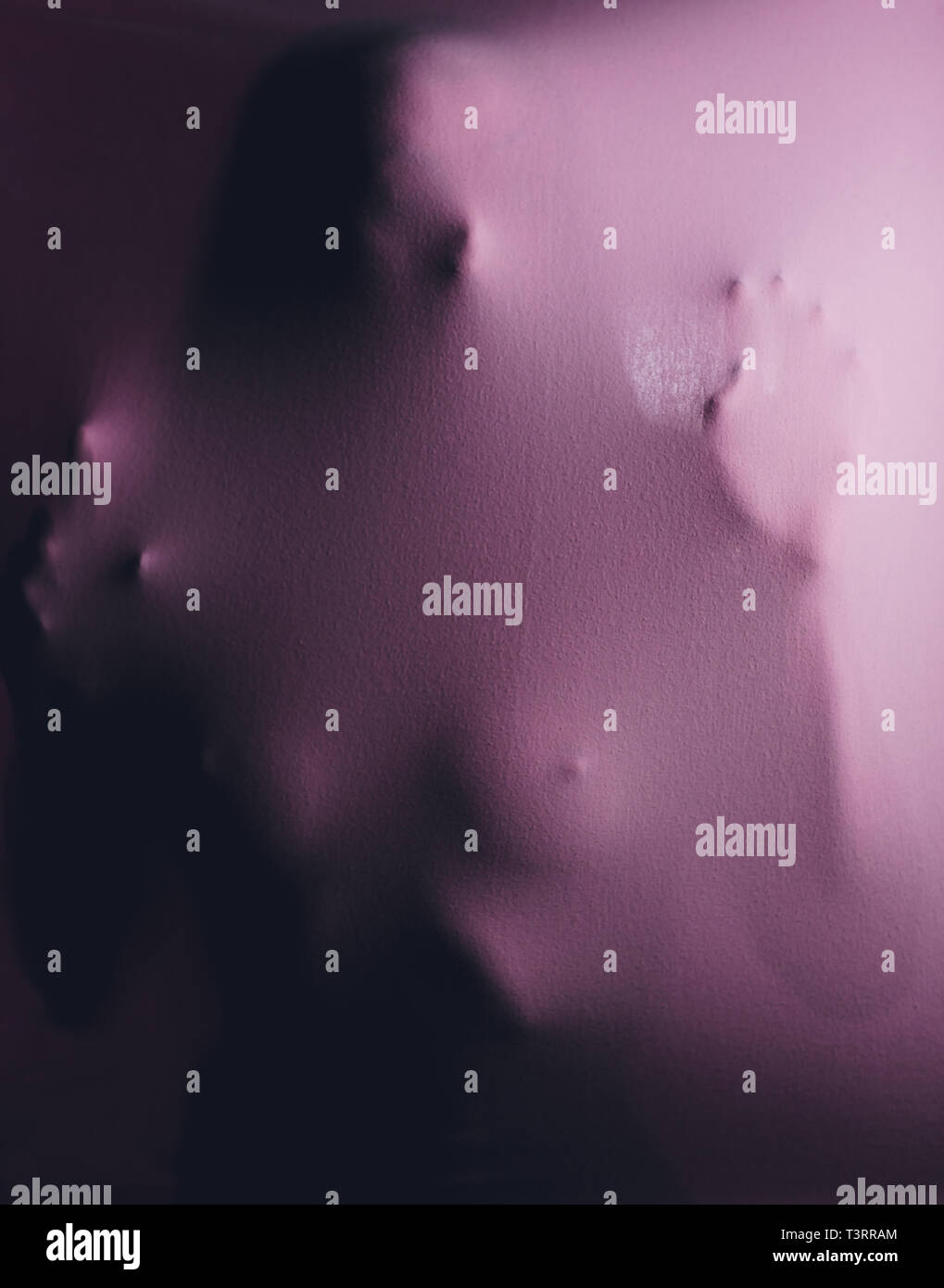 Art photo of a female silhouette breaking through the fabric. Struggle ...