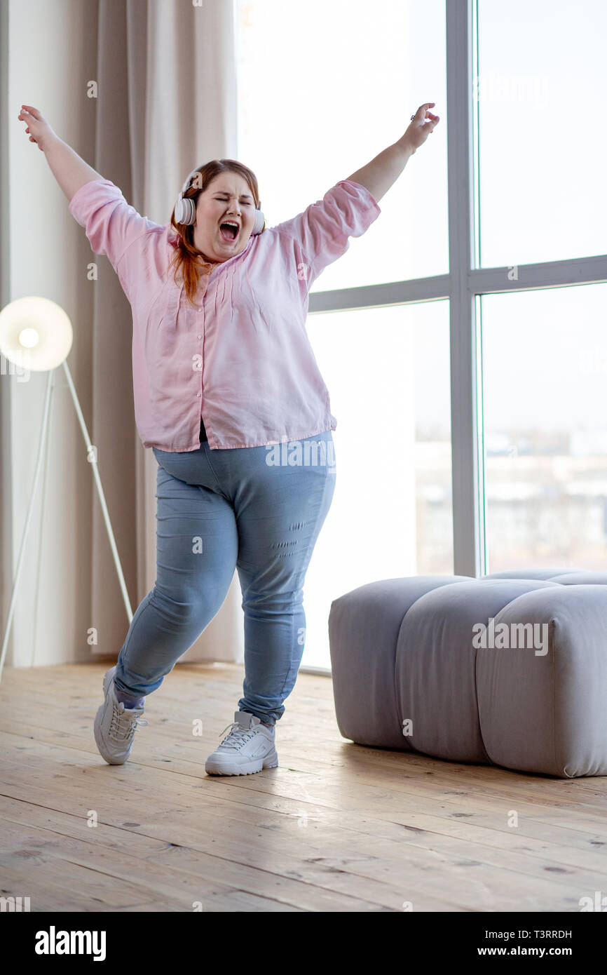 Cheerful nice woman showing her positive emotions Stock Photo - Alamy