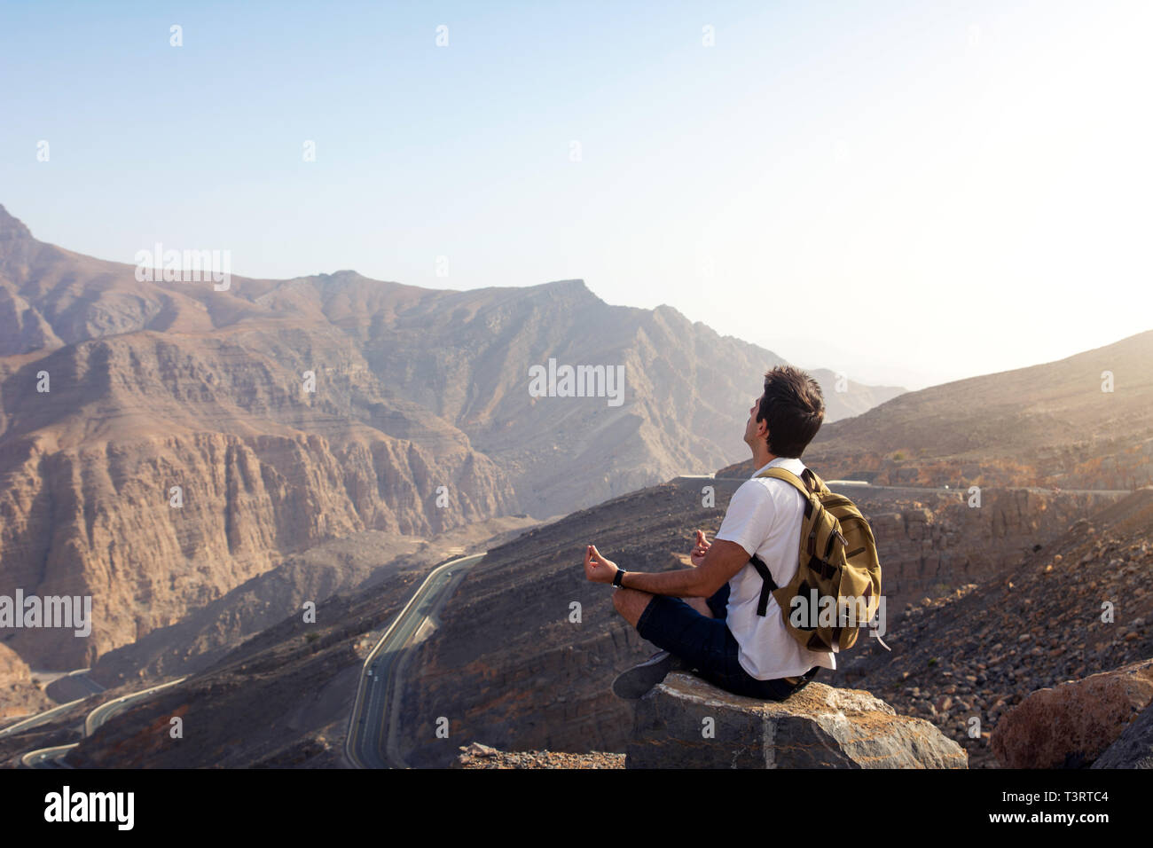 Man meditating on top mountain hi-res stock photography and images - Alamy