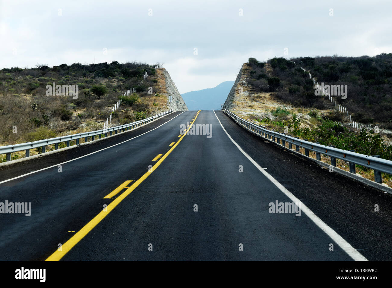 Road towards new adventures. Empty black road in the mountains. Photo ...