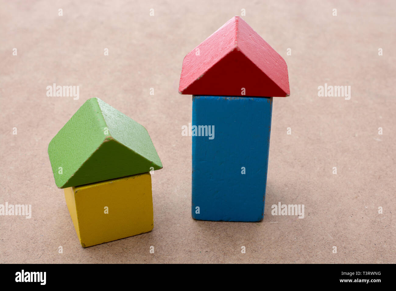 House shape formed out of building blocks on a brown background Stock ...