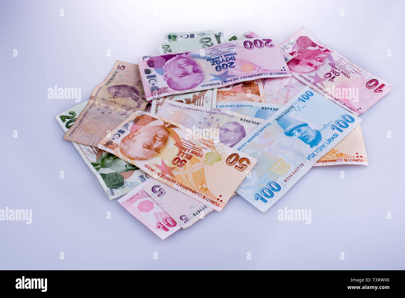 Turksh Lira banknotes of various color, pattern and value on white ...