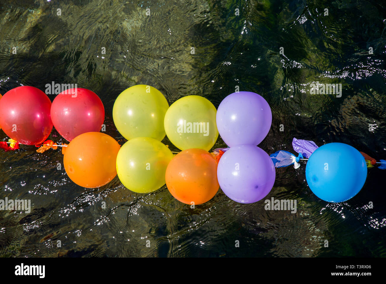 Balloons in shooting range as targets on water Stock Photo - Alamy