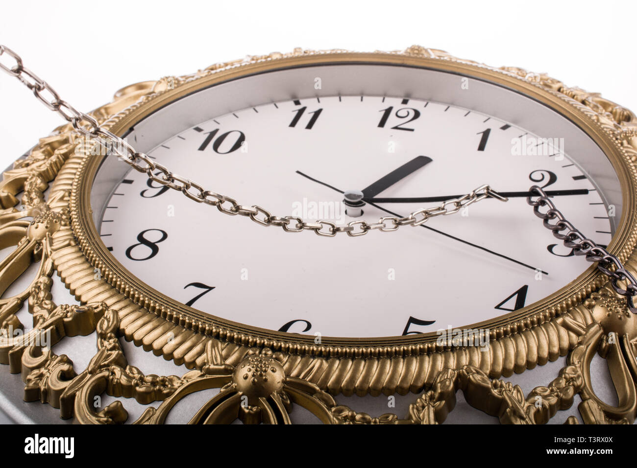 chained clock on a white background Stock Photo - Alamy