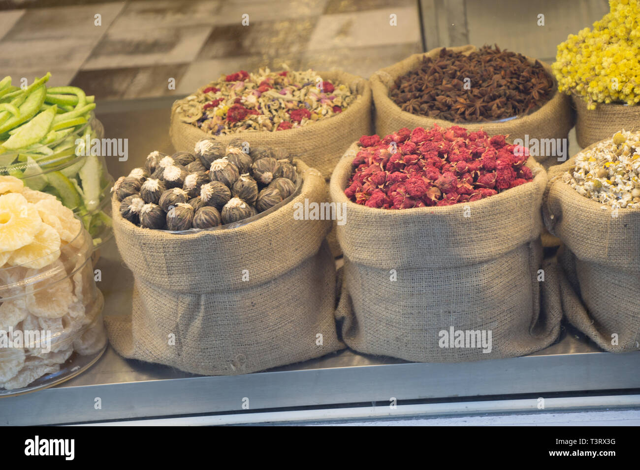 Dry herbal plants in baskets at the market Stock Photo - Alamy