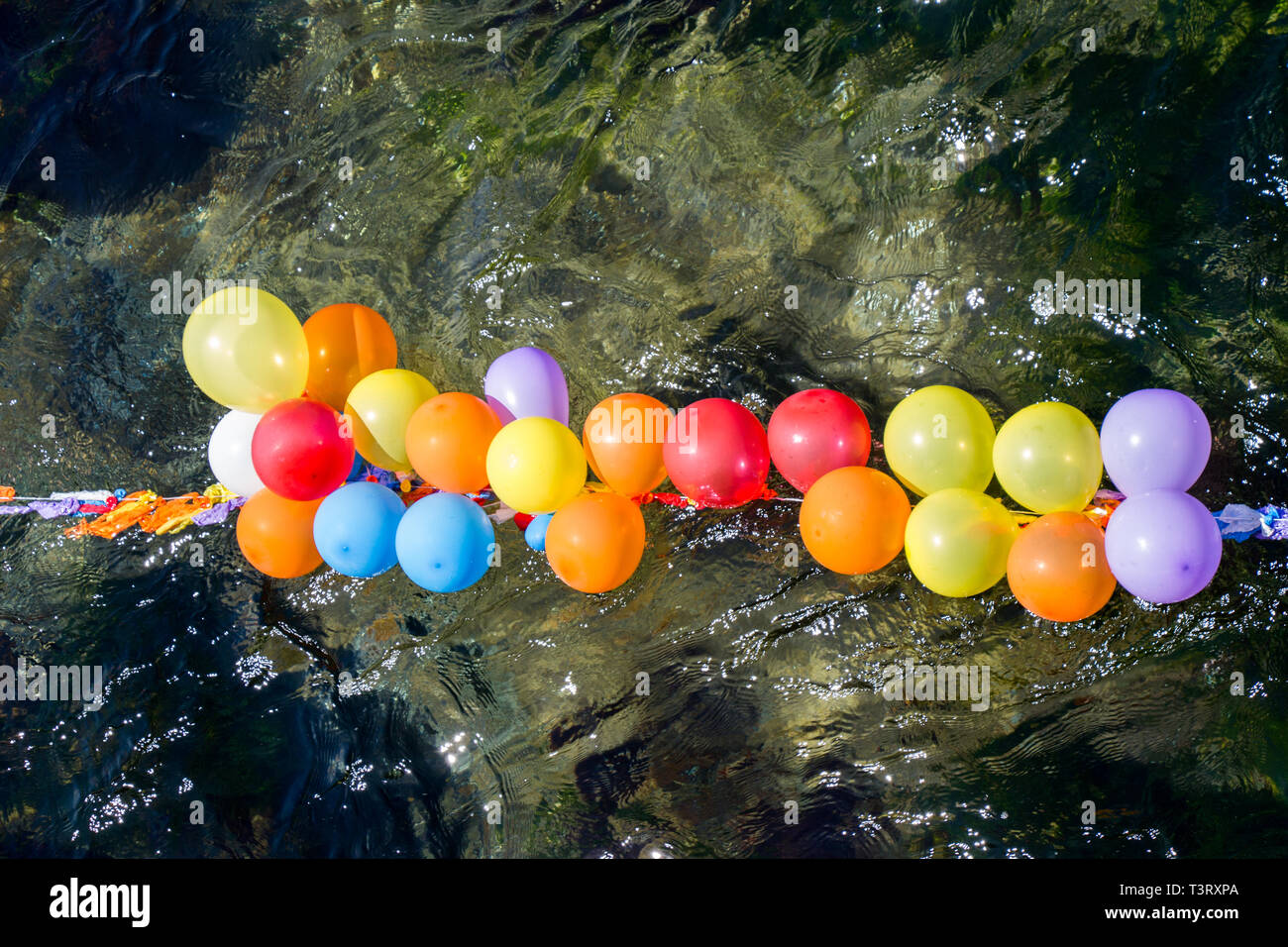 Balloons in shooting range as targets on water Stock Photo - Alamy