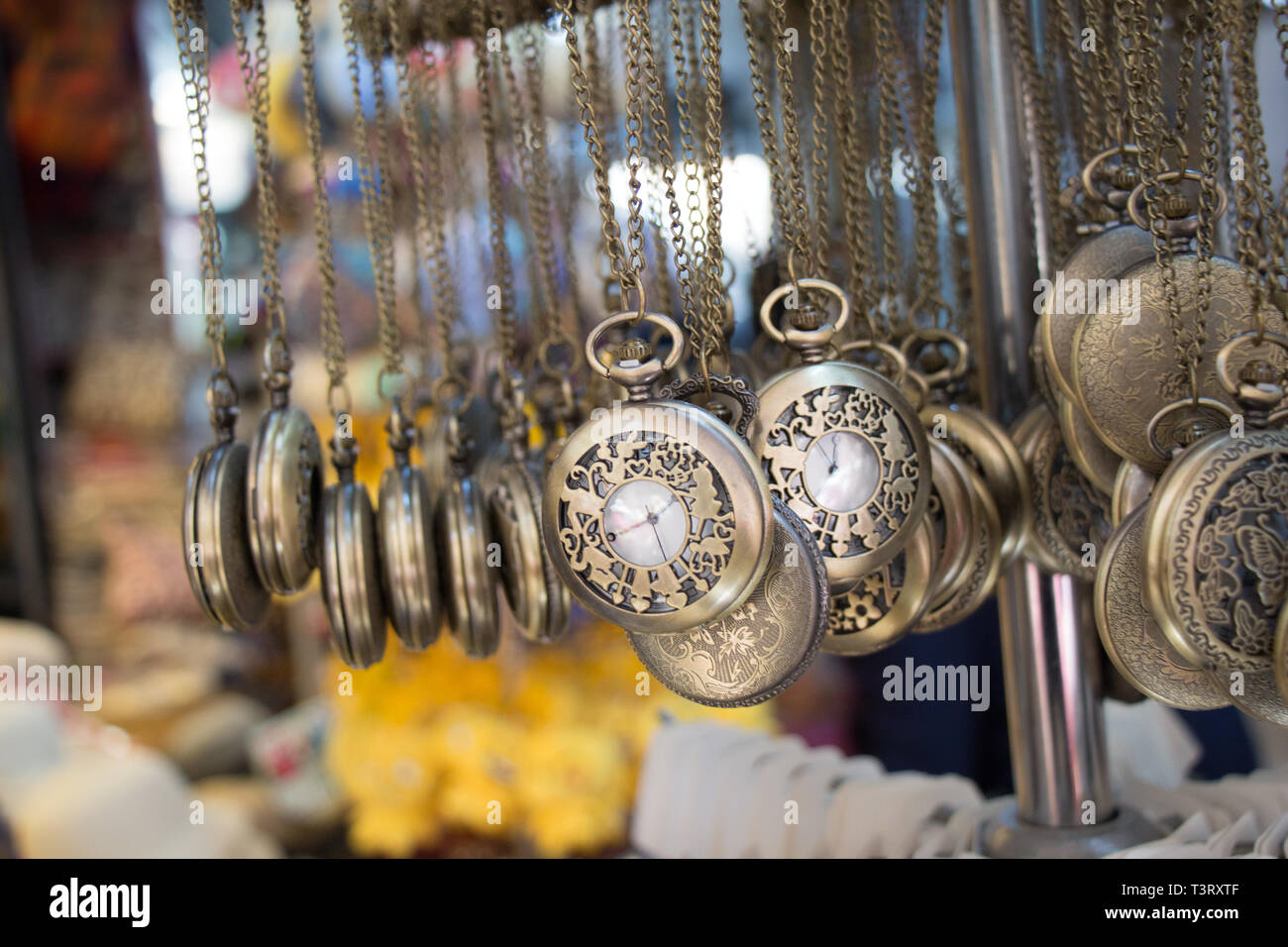 Set of retro styled pocket watches hanging Stock Photo - Alamy