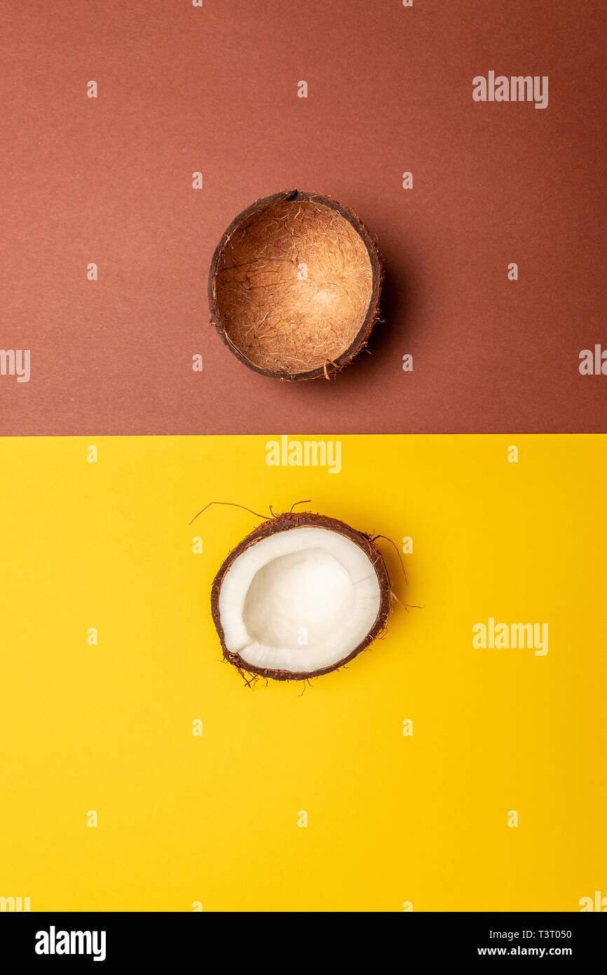 Creative layout of two pieces of coconut on a background Stock Photo ...