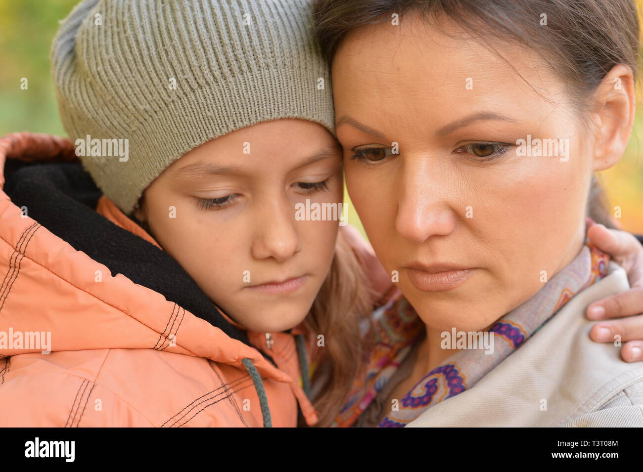 Mother hugging daughter sad hi-res stock photography and images - Alamy